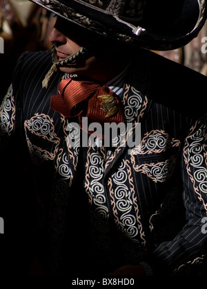 A Mexican charro wears an embroidered jacket at the National Charro ...