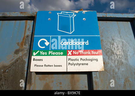 Close up of recyclable cardboard boxes for recycling behind wire in ...