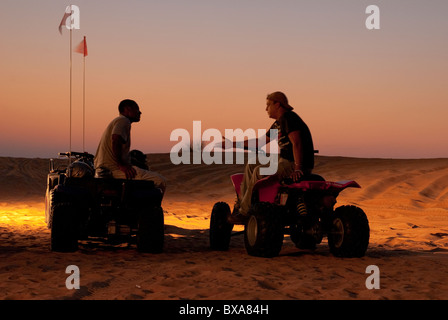 Quad bikes at sunset, Dubai Stock Photo - Alamy