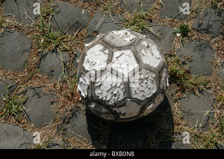 one old damaged football in field Stock Photo - Alamy