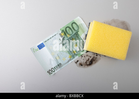 Banknote being cleaned with a sponge, symbolic image for dirty money ...
