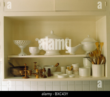Collection of cream crockery on shelves Stock Photo - Alamy
