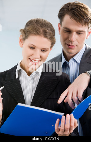 employee explaining business analysis to his colleague Stock Photo - Alamy