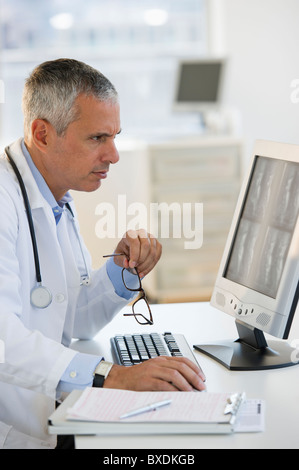 stethoscope and document on desk's doctor by doctor working in ...