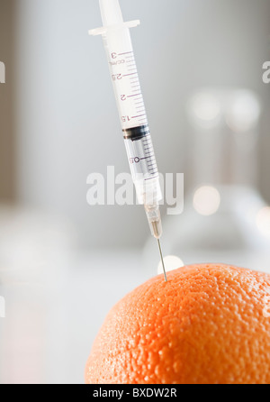 Orange and syringe Stock Photo - Alamy