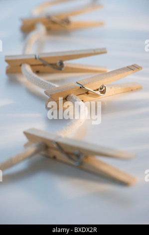 Clothespegs on a clothesline Stock Photo - Alamy