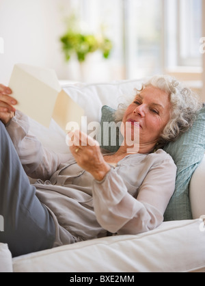 A woman reading angle cards Stock Photo - Alamy
