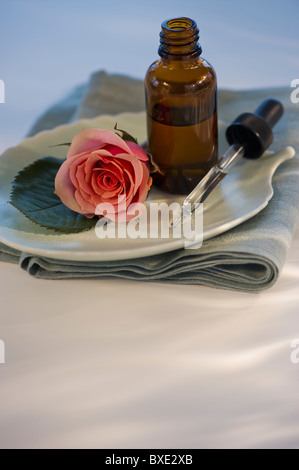 A vertical shot of the rose flowers on a wooden table Stock Photo - Alamy