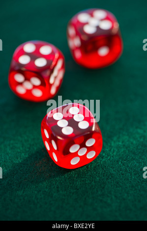 Red dice on a green felt Stock Photo - Alamy