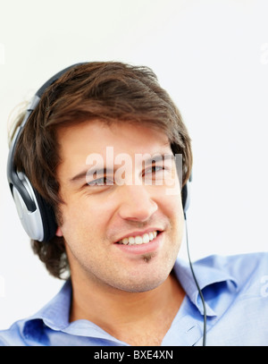 A vertical low angle shot of a modern building with flags at the bottom ...