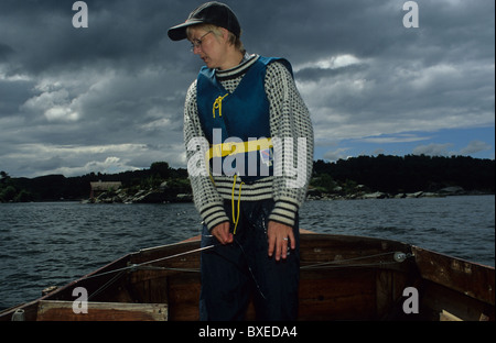 Women fishing from boat, fish, cod, mackerel, Women with fish from the ...