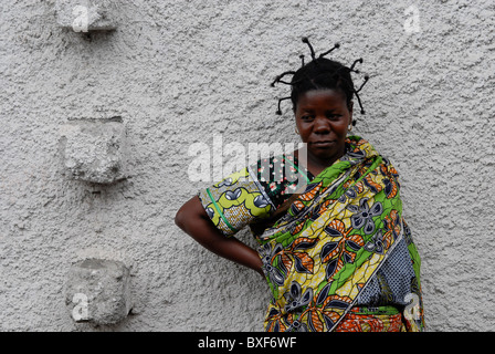 A woman with a traditional threading hairstyle wherein the hair is ...