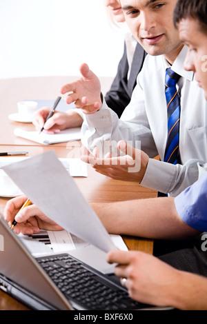 employee explaining business analysis to his colleague Stock Photo - Alamy
