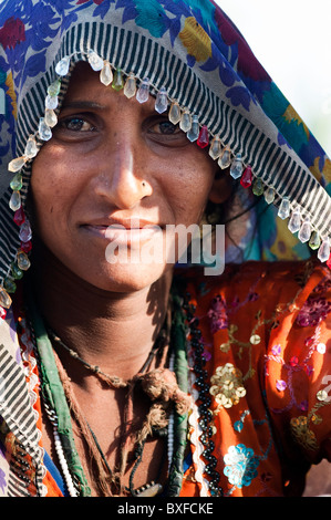 Gypsy tribal nomad tribe woman looking in mirror , Nanded , Marathwada ...