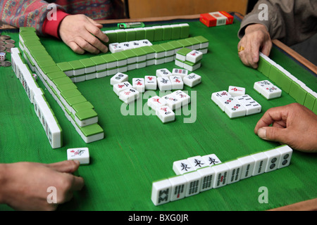 Chinese people play mahjong a traditional board game at the Temple of ...