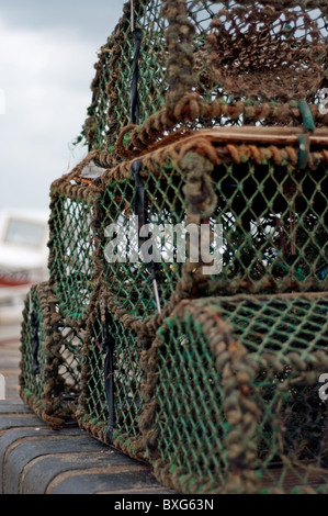 Creel Shaped Lobster pots arranged at the quay side awaiting the next ...