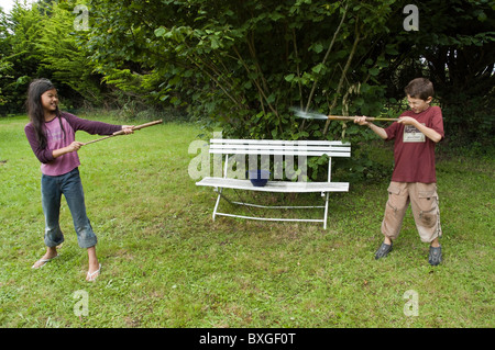 Two kids as friends fighting with each other for fun Stock Photo - Alamy