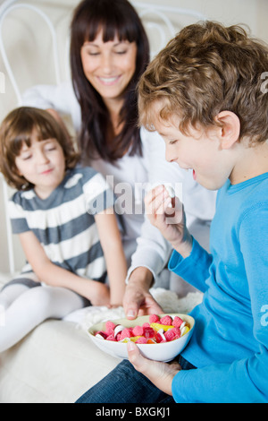 Boy and girl sharing sweets Stock Photo - Alamy