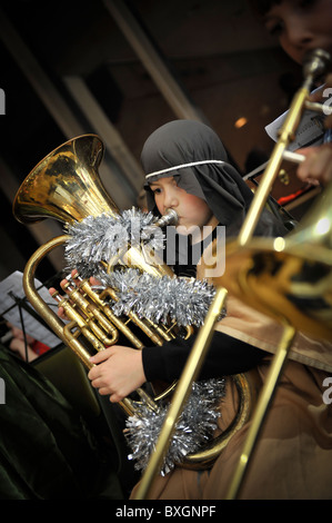 Children playing musical instruments in a primary school christmas ...