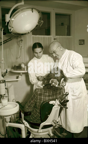medicine, dentistry, dentist during treatment, Bavaria, 1952 ...