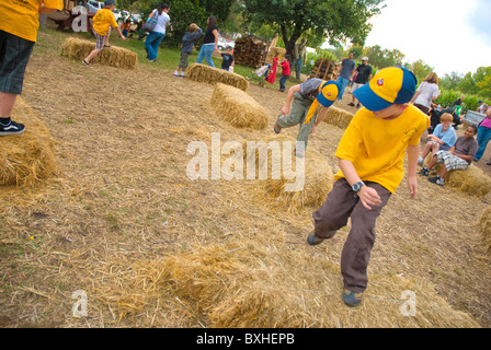Cub Scouts jumping hay bales Stock Photo - Alamy