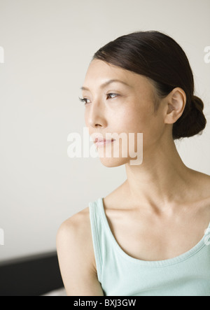 A woman turning sideways Stock Photo - Alamy