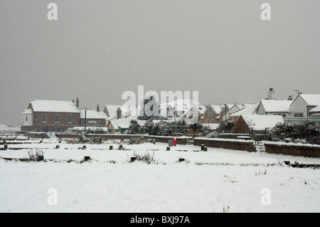 Snow falling Whitstable Kent beach huts covered in snow Stock Photo - Alamy