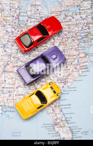 Cars driving across map Stock Photo - Alamy