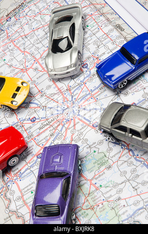 Cars driving across map Stock Photo - Alamy