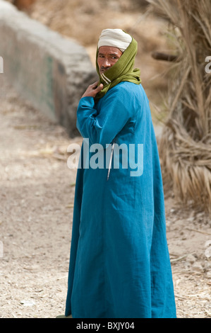 Man in Egyptian dress (gallibaya) outside the 70m high Meidum Pyramid ...