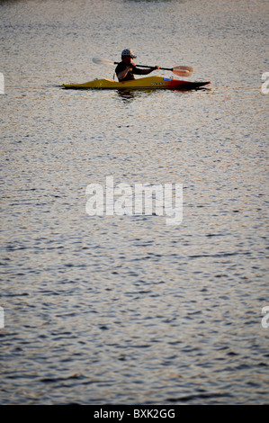 A beautiful landscape of a lake with a silhouette of a kayaker Stock ...