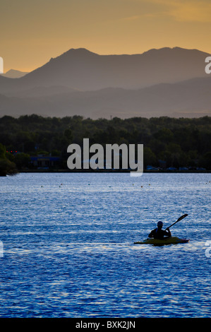 A beautiful landscape of a lake with a silhouette of a kayaker Stock ...