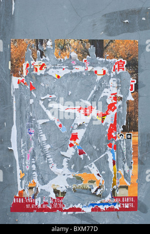 teared up layers of posters on a concrete wall Stock Photo - Alamy