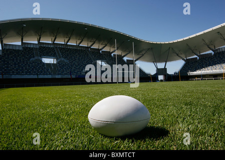 Rugby ball on field with goal posts Stock Photo: 51698901 - Alamy
