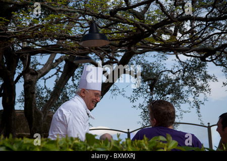 Chef talking with customers in restaurant Stock Photo - Alamy