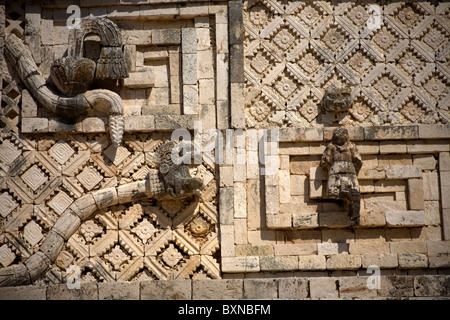 A sculpture of a serpent representing god Kukulkan in the Mayan ruins ...