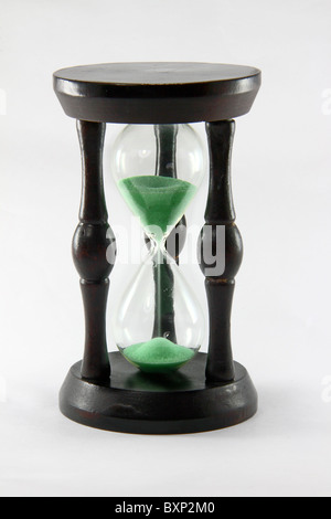 An hour-glass timer full of sand Stock Photo - Alamy