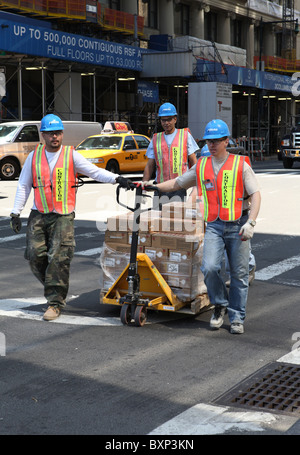 Construction Contractors building a big new home Stock Photo - Alamy