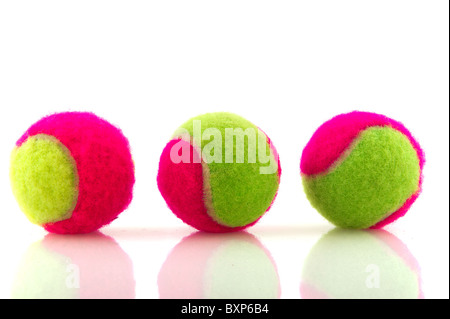 Row colorful tennis balls in green and pink Stock Photo - Alamy