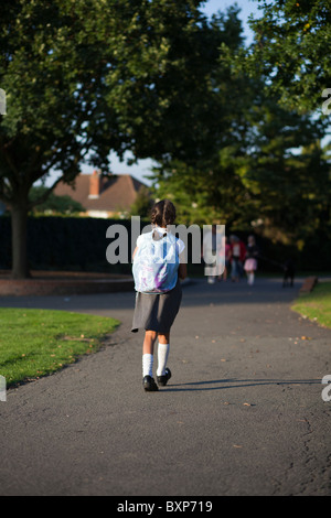 girl walking home from school Stock Photo - Alamy