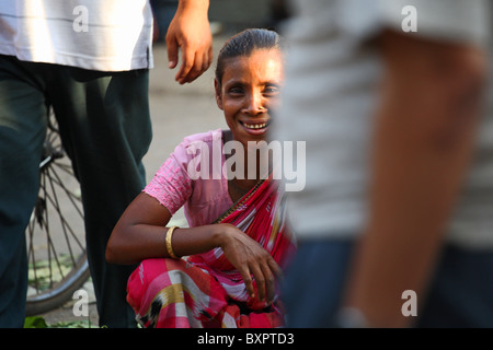 Pretty Indian woman crouching Stock Photo - Alamy