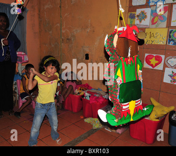 Child breaking pinata , Christmas celebrations San Jose Costa Rica ...
