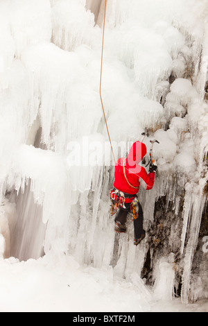 A climber on Fisher Place Ghyll above Thirlmere in the Lake District ...