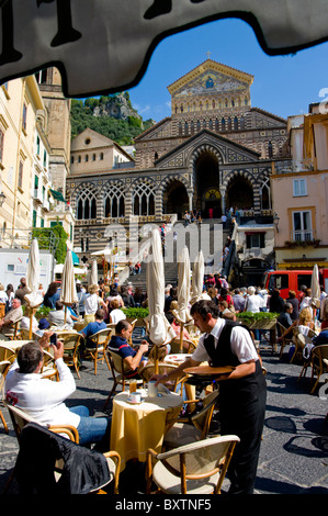 Italy, Neapolitan Riviera, Amalfi, people sunbathing on beach Stock ...