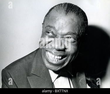 LOUIS ARMSTRONG (1901-1971) US jazz musician is presented with a ...