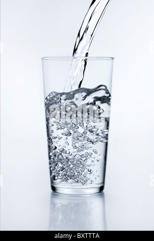 Fresh drinking water dripping and pouring from a tap Stock Photo - Alamy