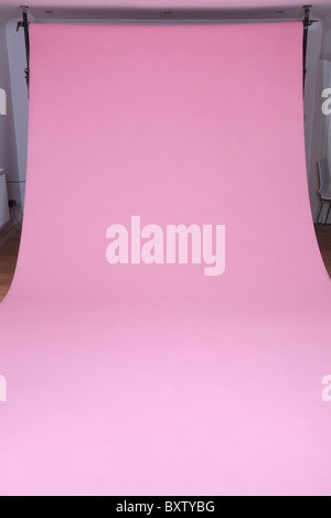 Pink photographic studio backdrop Stock Photo - Alamy