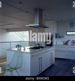 Extractor above hob in island unit in large modern Spanish apartment ...