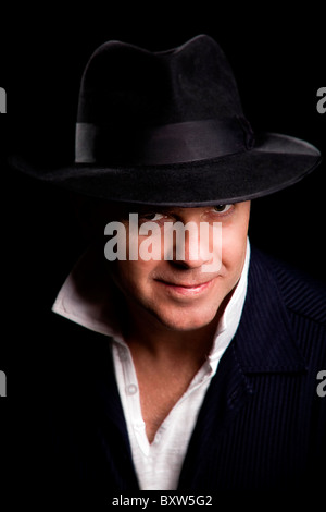 A mature male artist singer wearing a black Fedora Timberlake styled ...