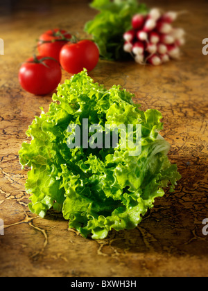 Fresh green salad lettuce on a field Stock Photo - Alamy